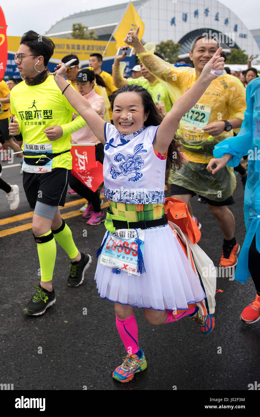 Wuhan. 9th Apr, 2017. Runners compete in the rain during 2017 Wuhan ...