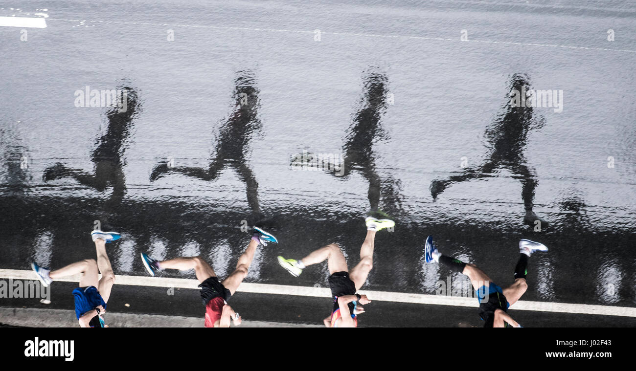 Wuhan. 9th Apr, 2017. Photo rotated 180 degrees shows runners compete ...