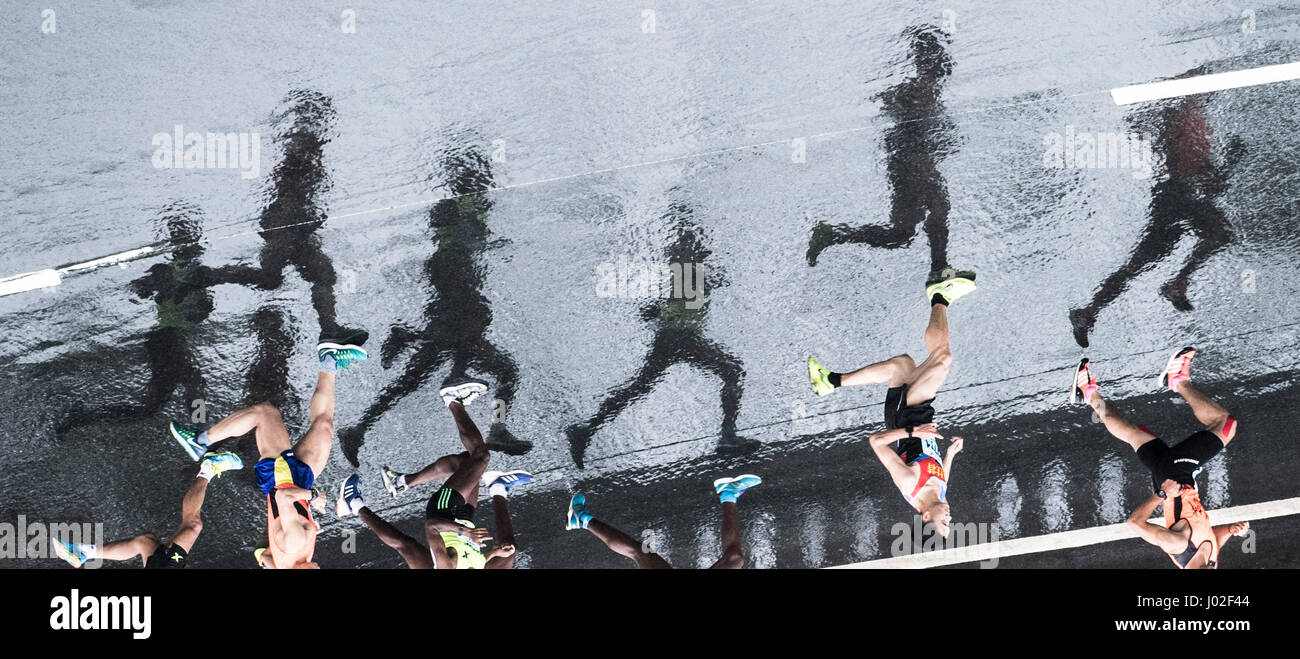 Wuhan. 9th Apr, 2017. Photo rotated 180 degrees shows runners compete ...