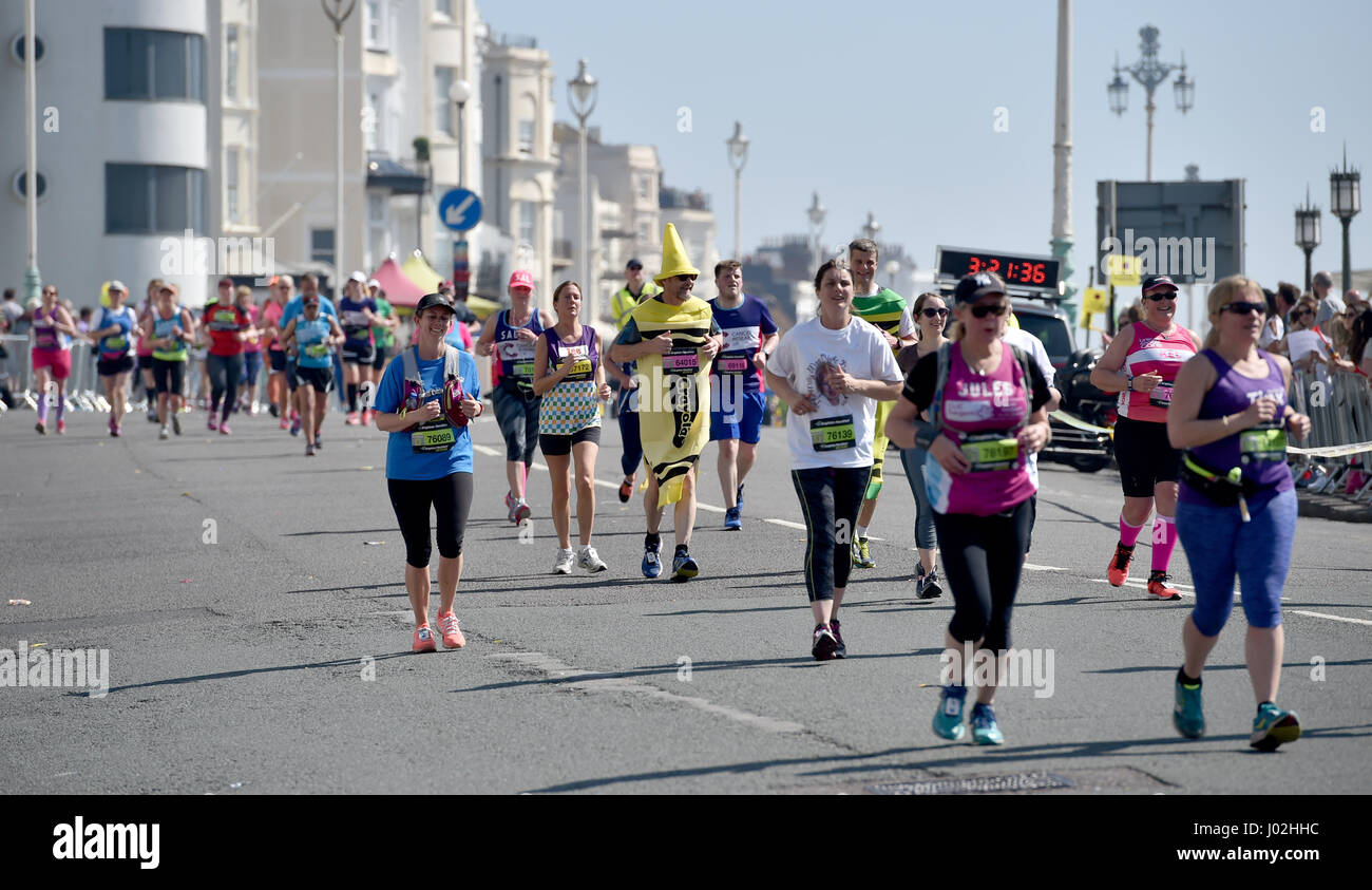 Brighton UK 9th April 2017 - A runner in fancy dress finds it hot work ...