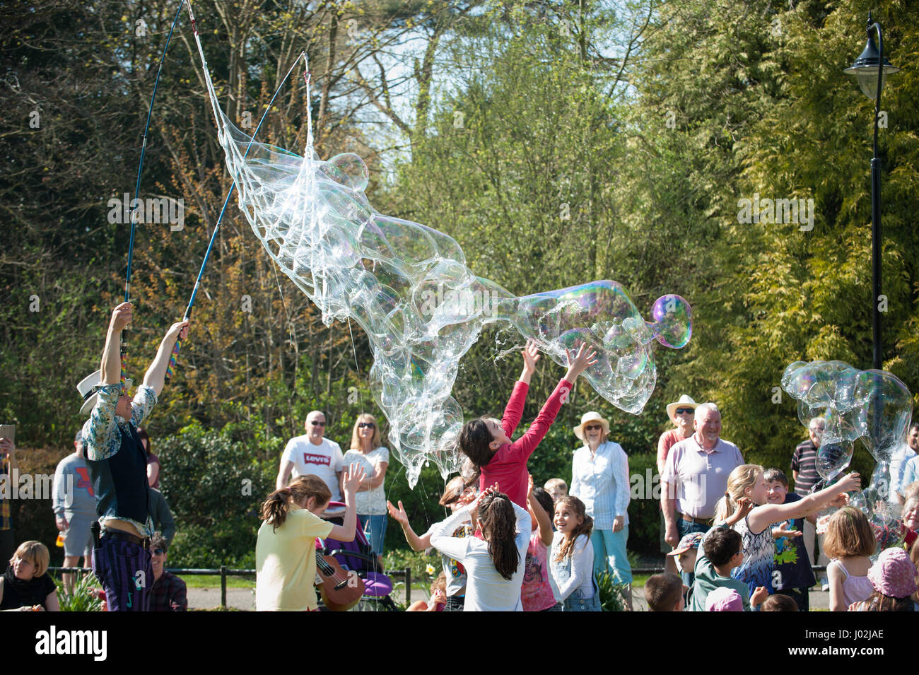 Children try to burst bubbles during a family event at Hotham Park ...