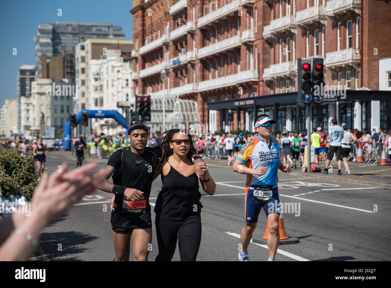 Helping runner marathon hi-res stock photography and images - Alamy