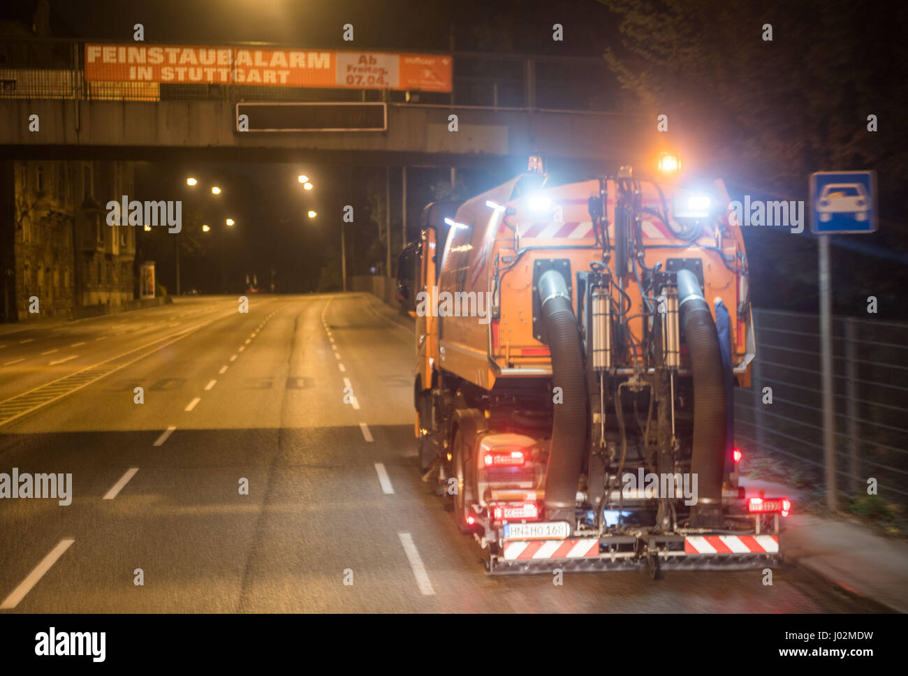 A street cleaning vehicle fitted with special equipment drives through ...
