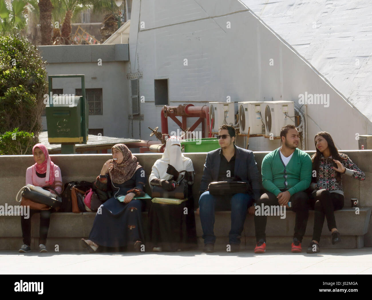 Alexandria, Egypt. 7th Apr, 2017. Men and women sit outside the new ...