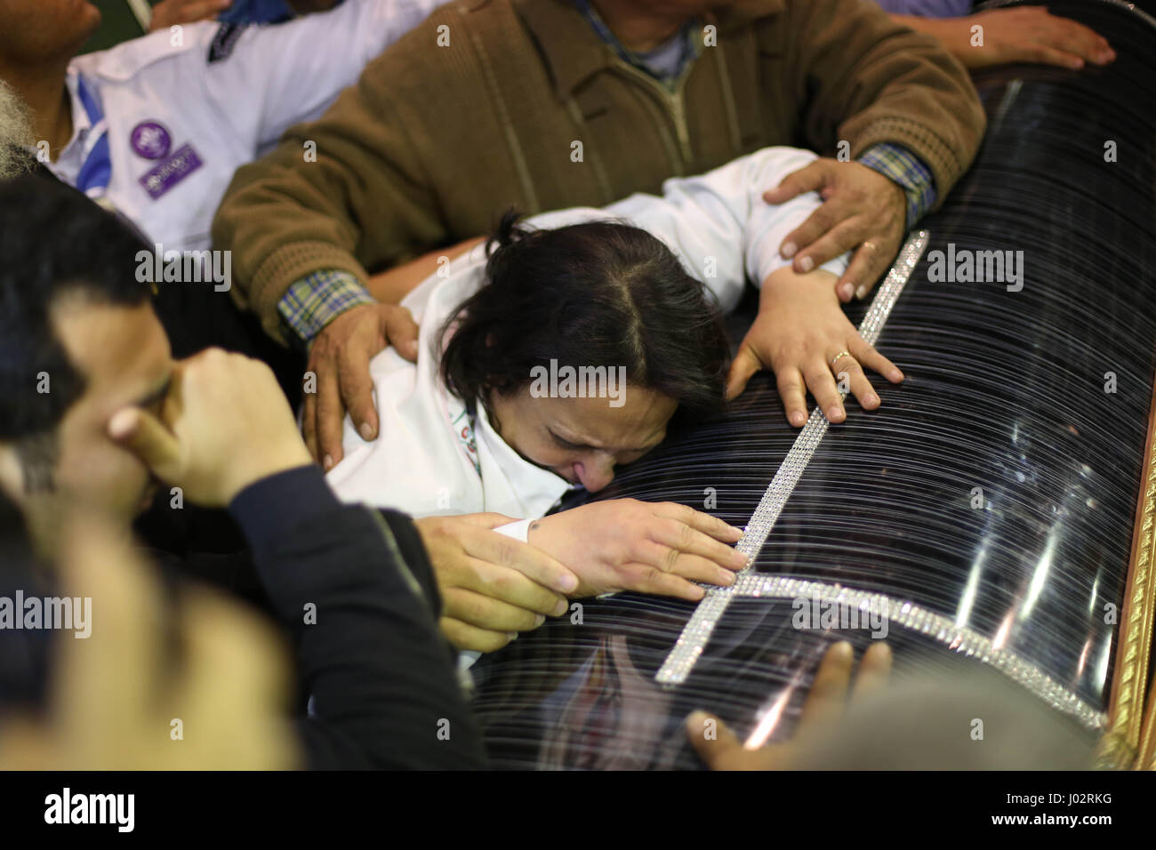 Tanta, Egypt. 9th Apr, 2017. Relatives cry at the church blast victims ...