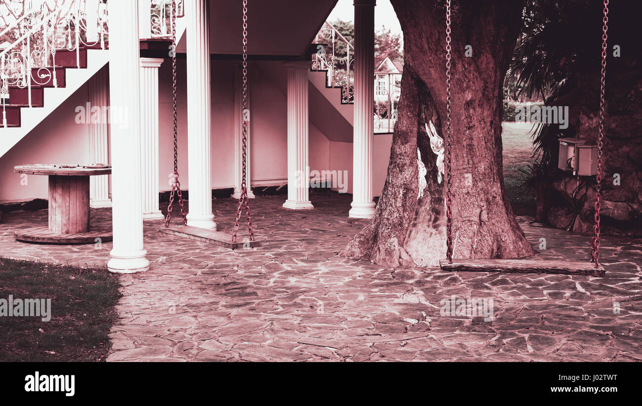 Swing under the big tree, Lonely atmosphere Stock Photo - Alamy