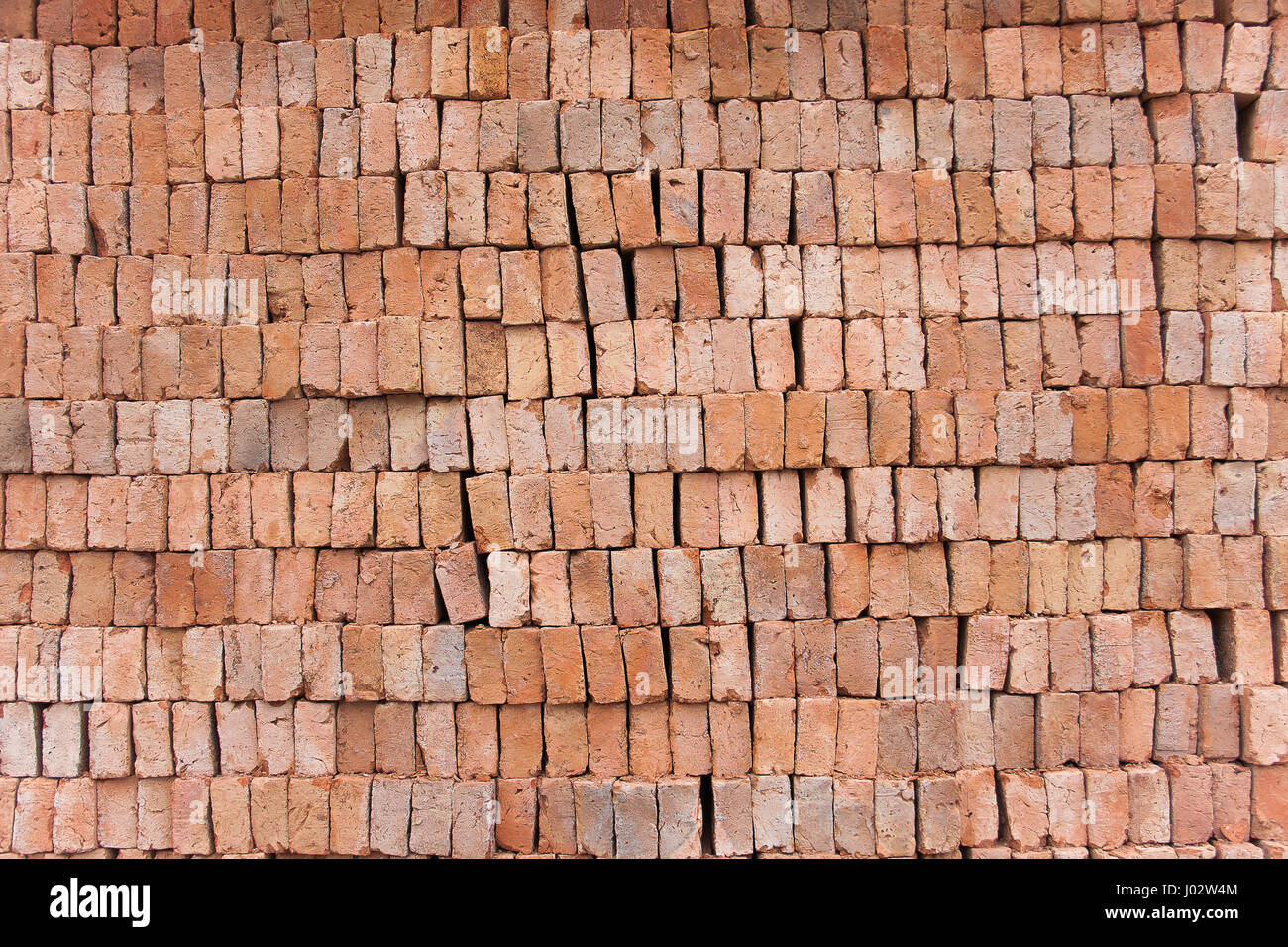 big stack of red clay block for wall construction, texture Stock Photo ...
