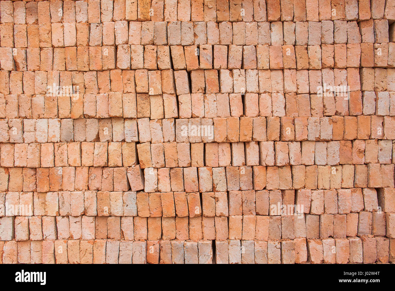 big stack of red clay block for wall construction, texture Stock Photo ...