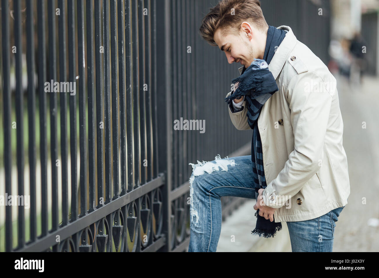 Fashionable man standing outdoors with white background Stock Photo - Alamy