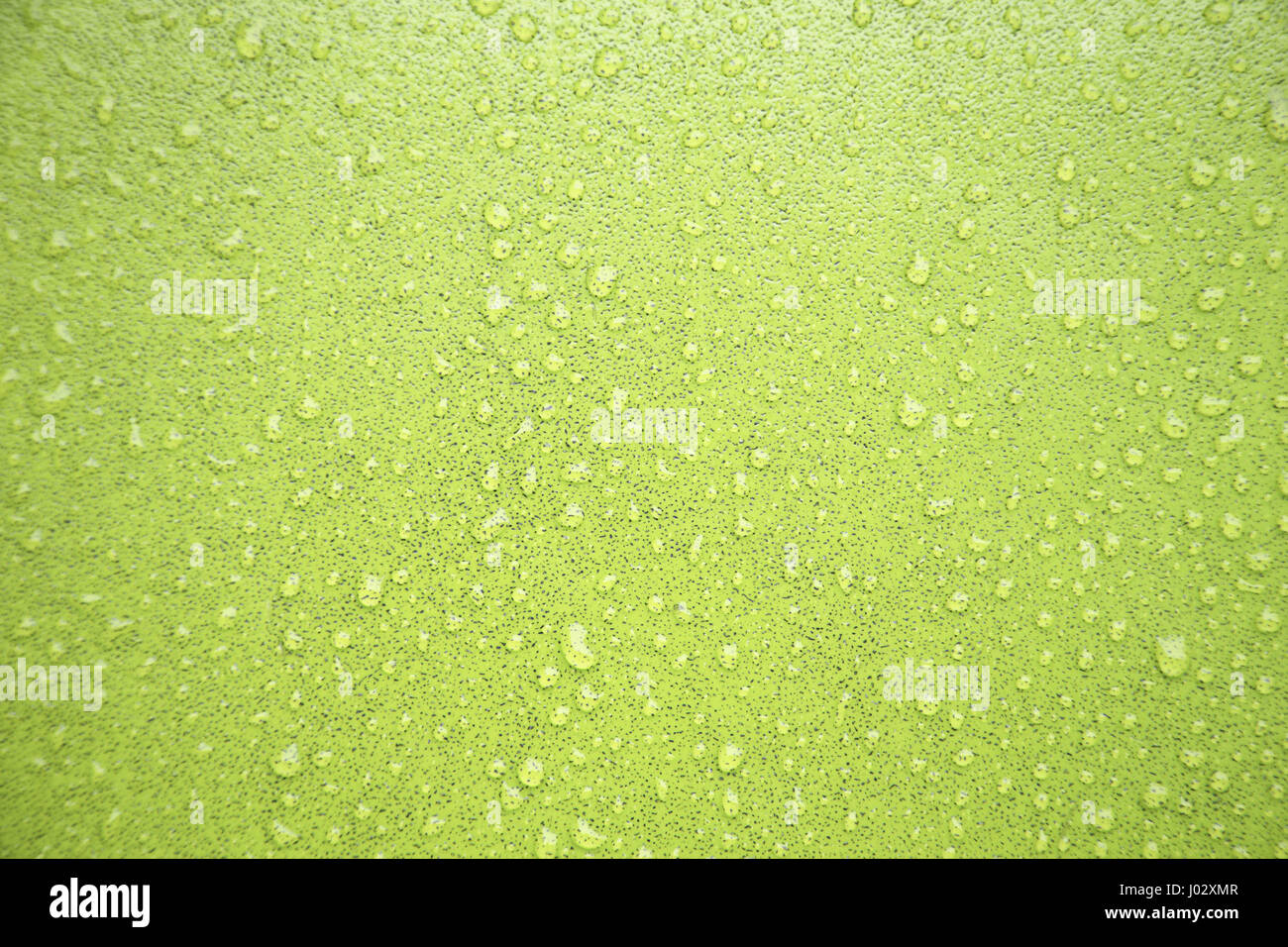 Water drops on blue, detail of a wet blue surface water, rain in the ...