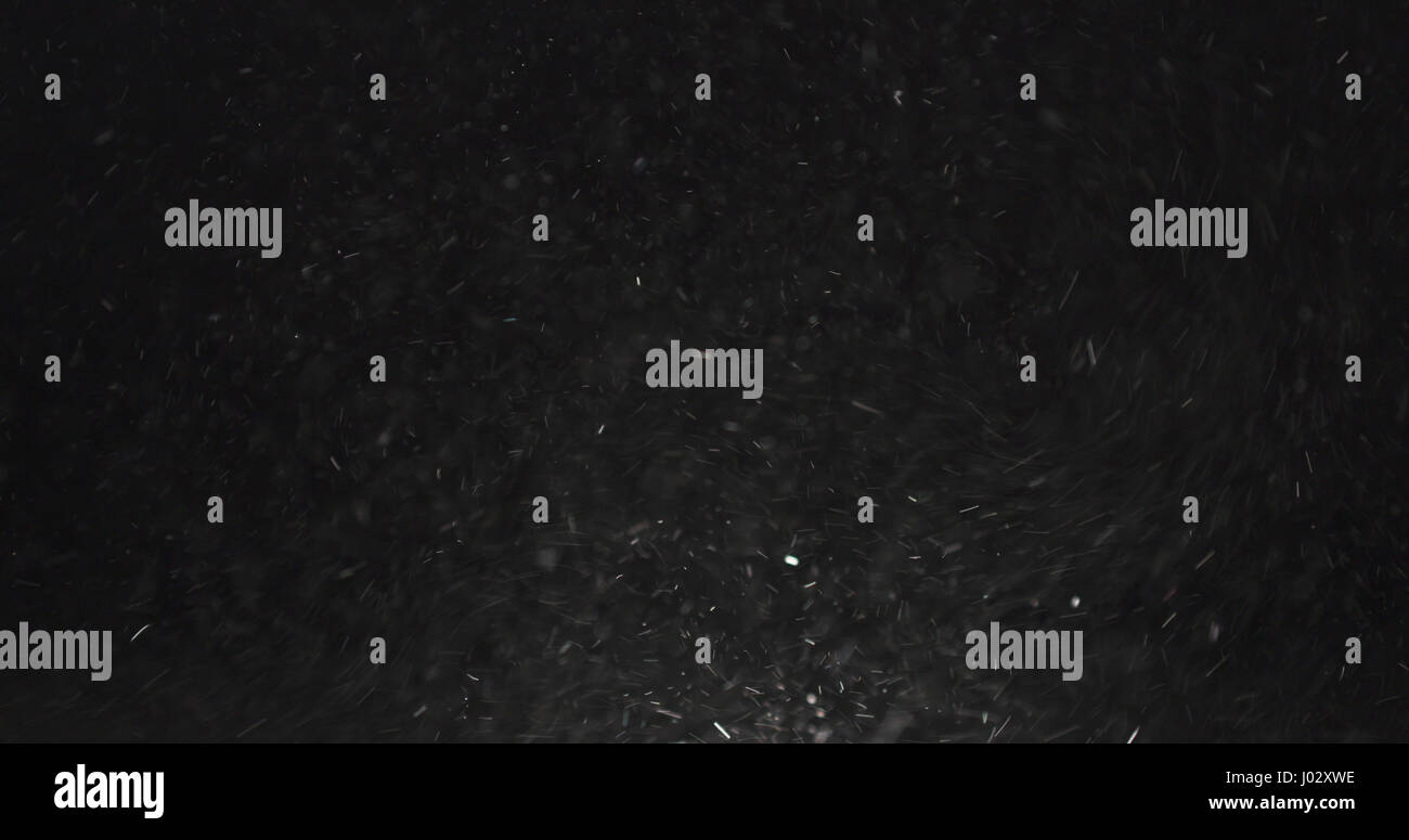 dust particles fast moving over black background from right, 4k photo ...