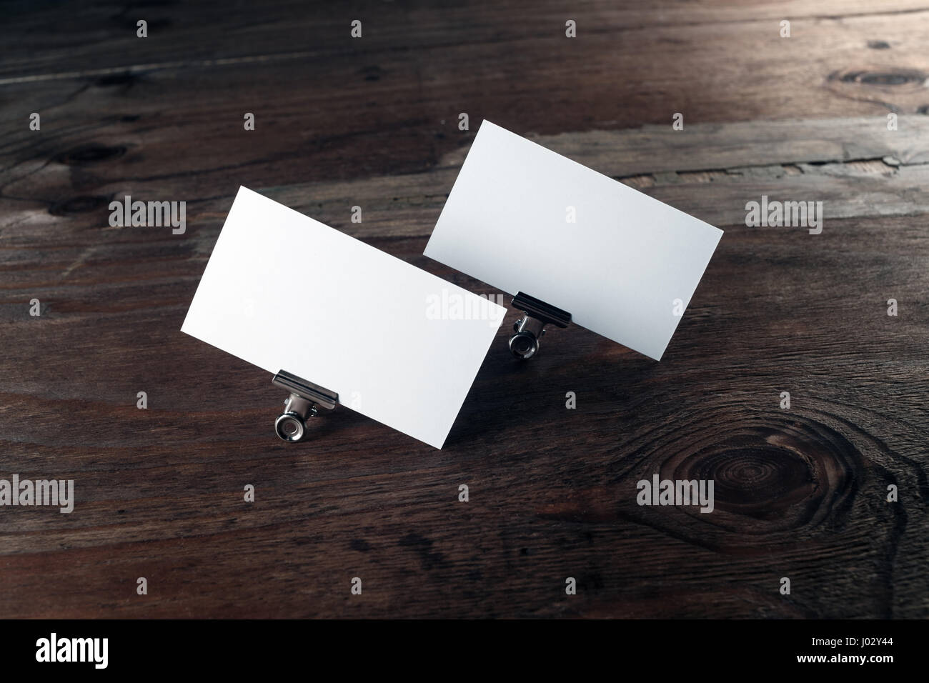 Photo of blank business cards on wooden table background. Mock up for ...