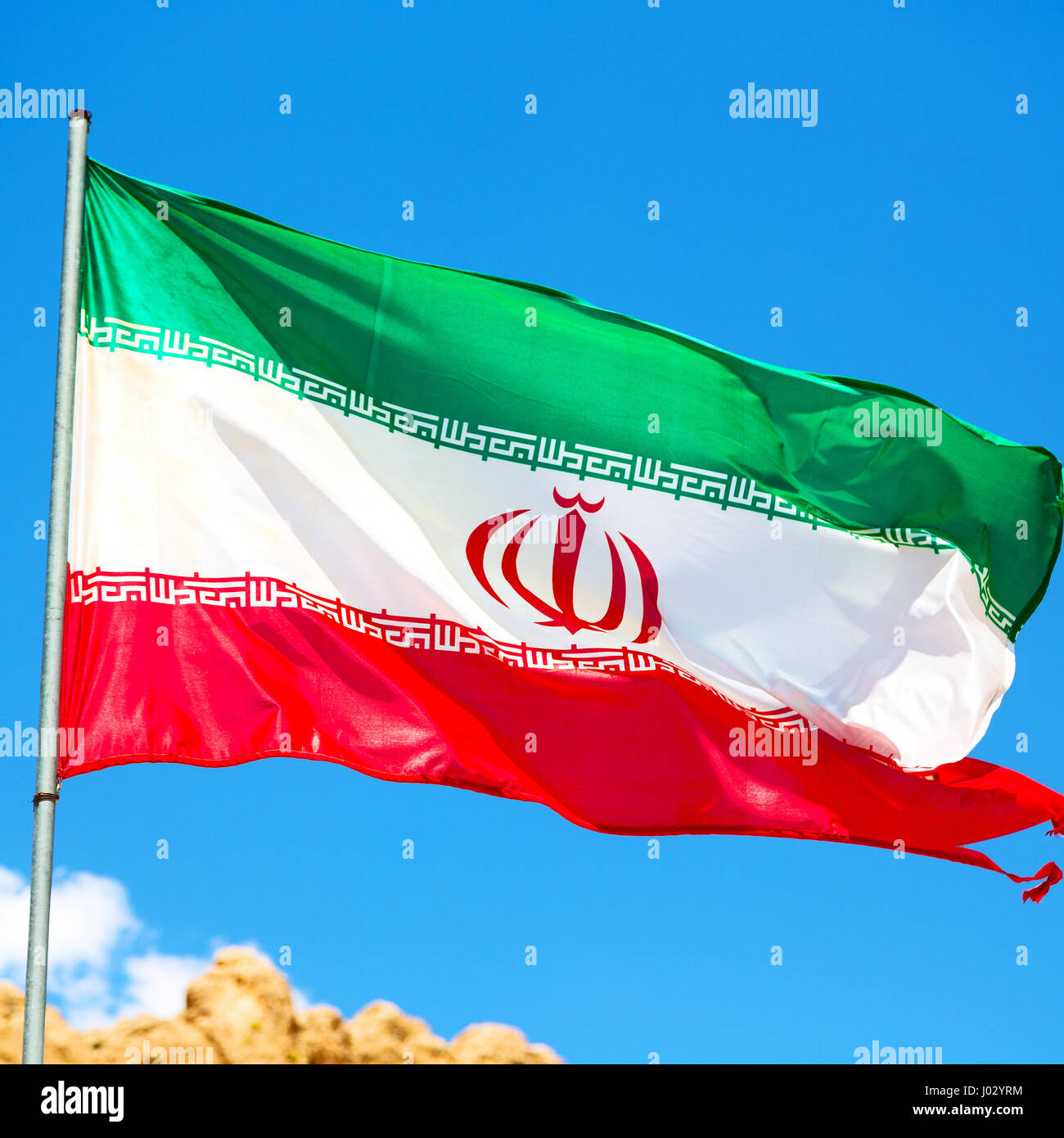 in iran blur iranian waving flag the blue sky and wind Stock Photo - Alamy