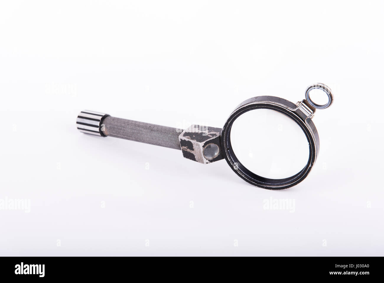 Magnifying glass on a white background, expert tools Stock Photo - Alamy