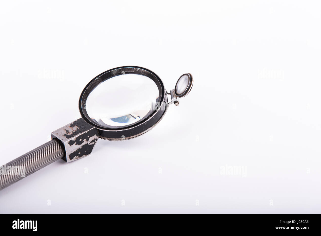 Magnifying glass on a white background, expert tools Stock Photo - Alamy