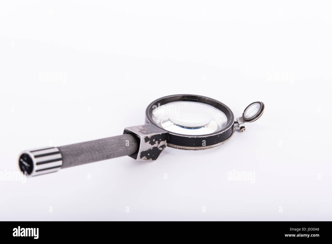 Magnifying glass on a white background, expert tools Stock Photo - Alamy