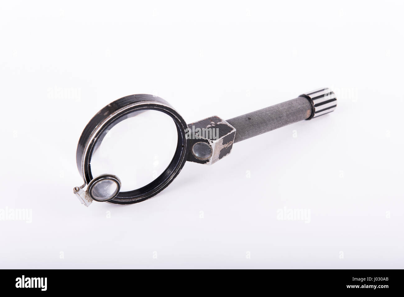 Magnifying glass on a white background, expert tools Stock Photo - Alamy