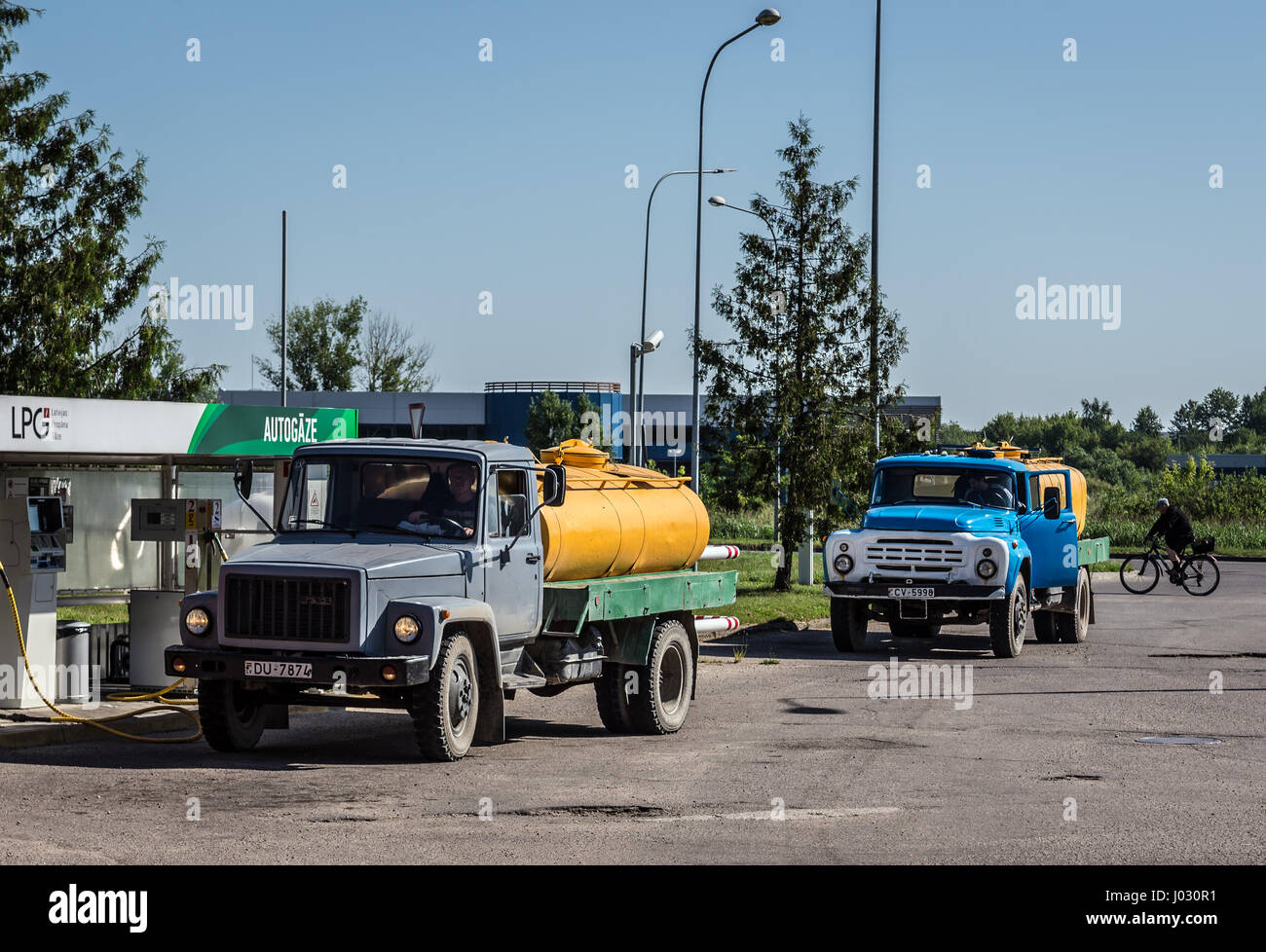 Old Soviet tanker trucks ZiL and GAZ on a gas station in Daugavpils ...