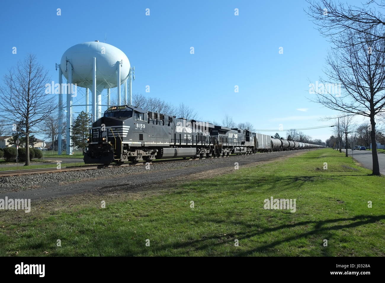 NS oil train 65K passes west past the iconic water tower in Manville,NJ ...