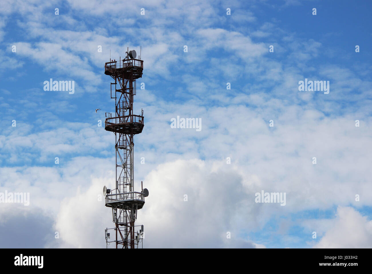 Television tower against the blue sky with clouds Stock Photo - Alamy