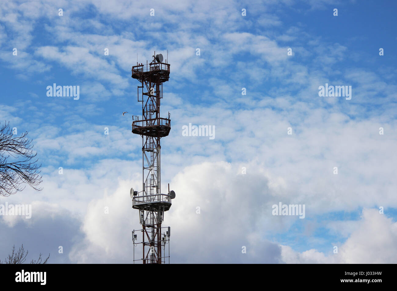Television tower against the blue sky with clouds Stock Photo - Alamy