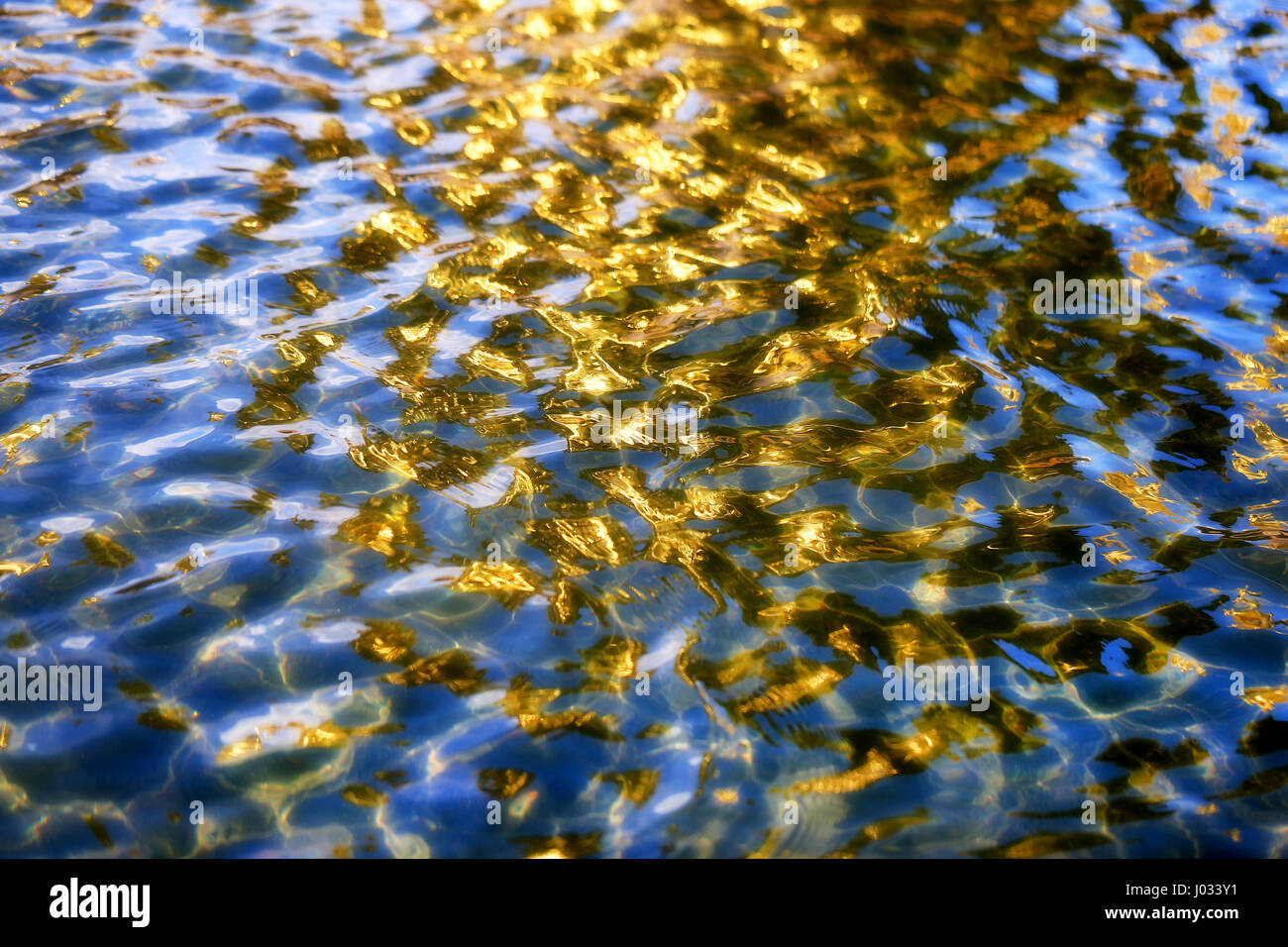 Beautiful Golden reflection on the water to photograph closeup Stock ...