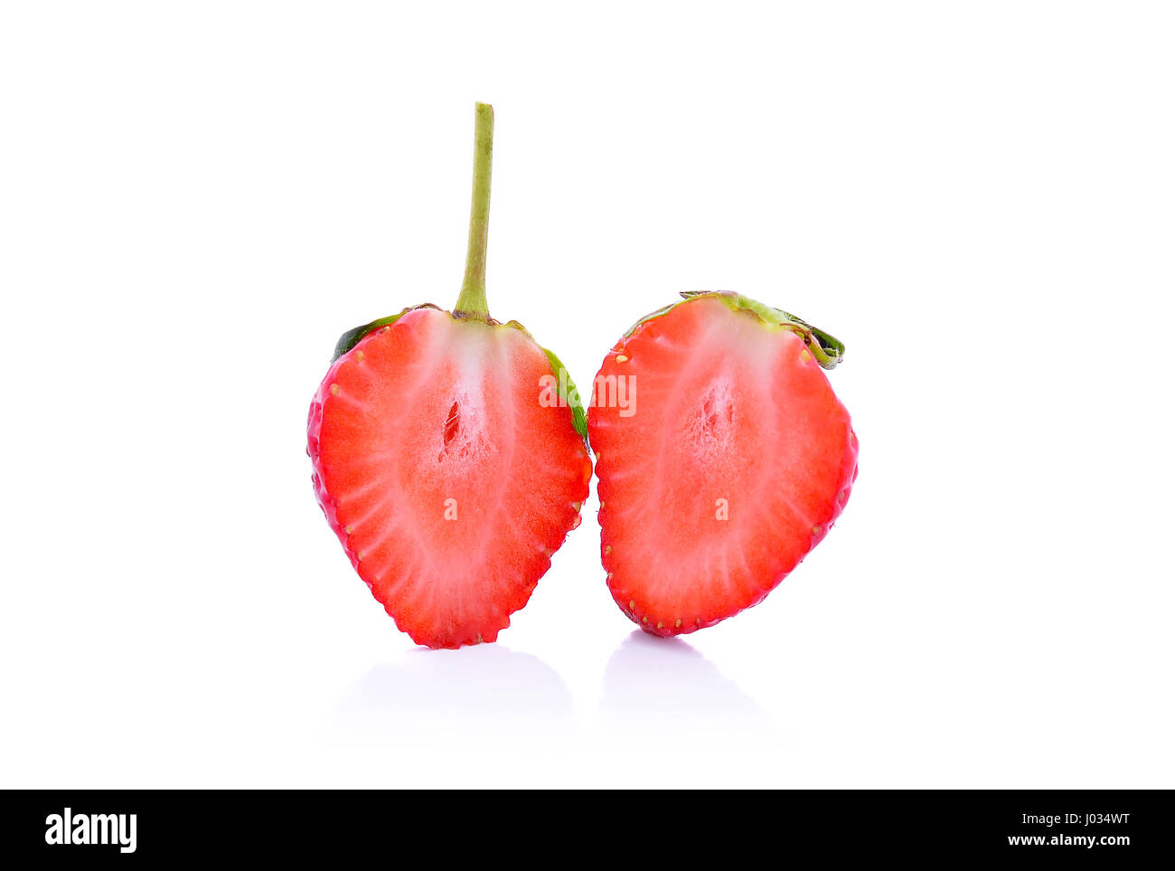 half strawberries isolated on white background Stock Photo - Alamy