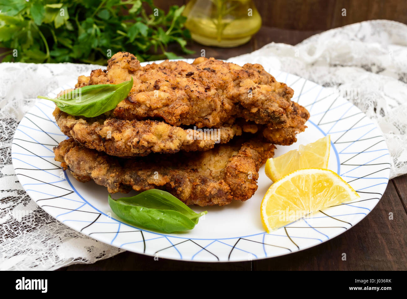 Homemade "Vienna" schnitzel on a plate. A traditional dish of Austrian ...