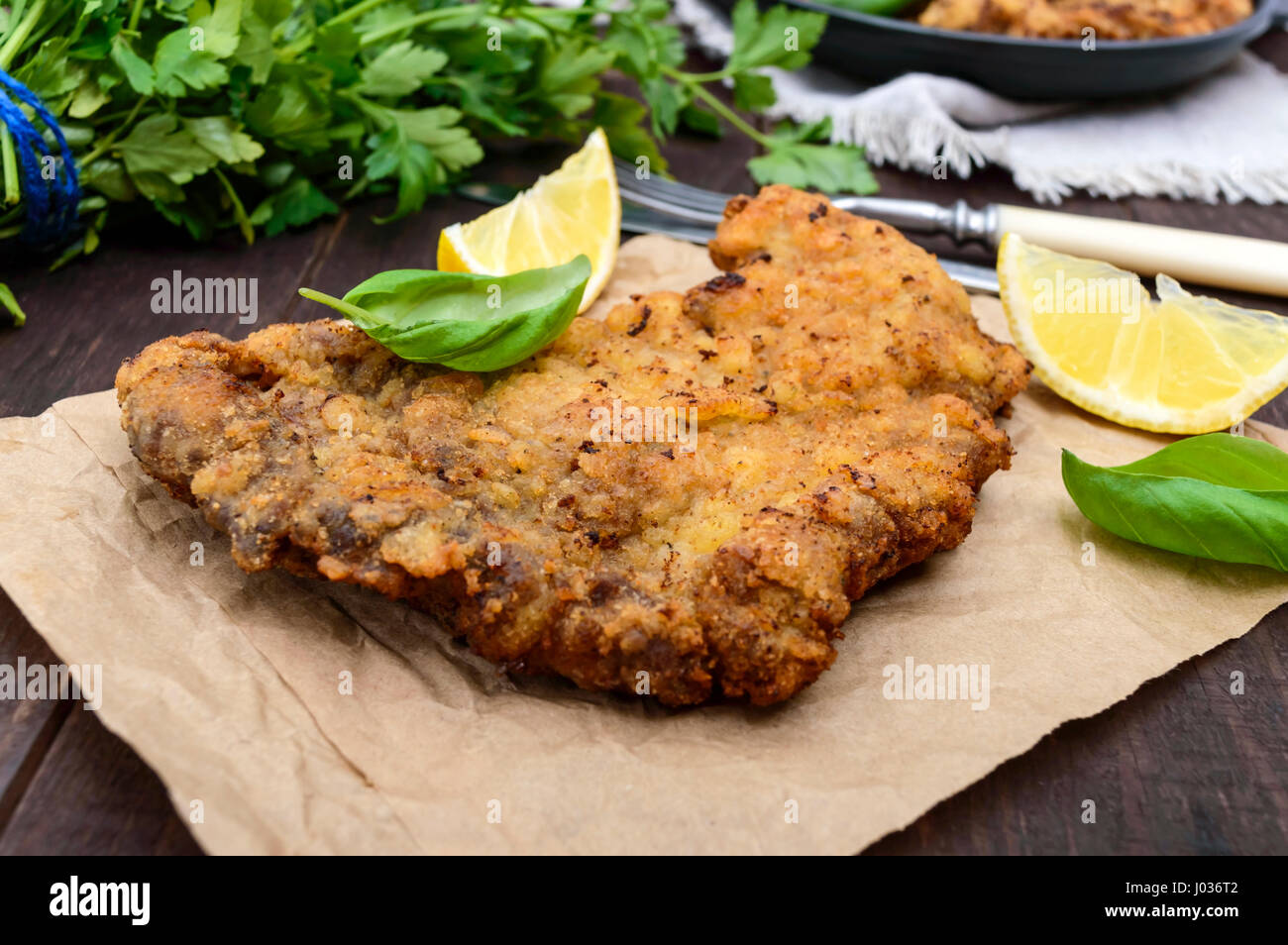 Homemade "Vienna" schnitzel on the wooden background. A traditional ...