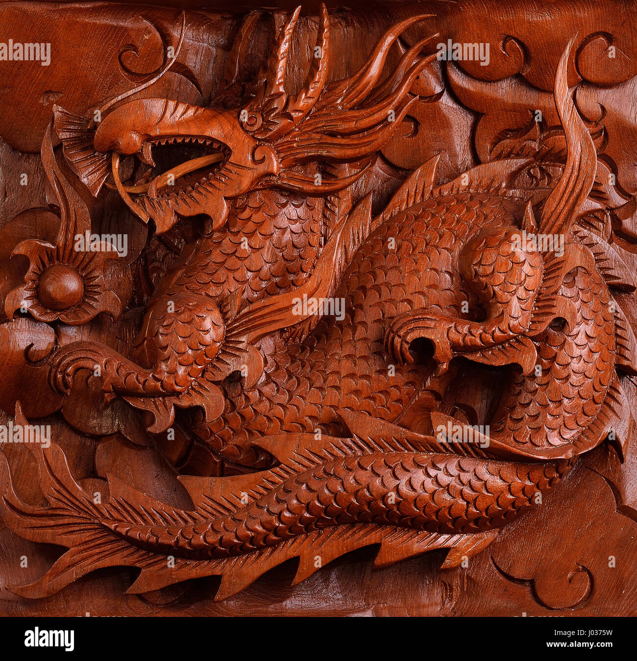 Close up the wood carving of a dragon Stock Photo - Alamy