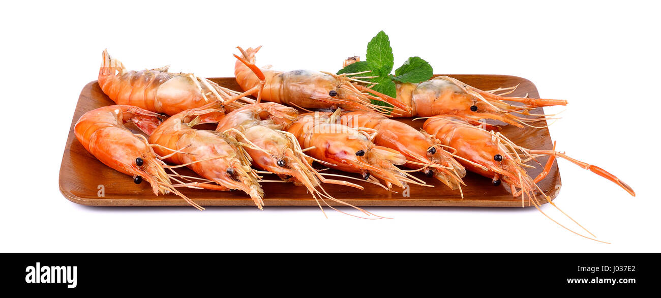 Raw shrimps on wooden Cut Out Stock Images & Pictures - Alamy