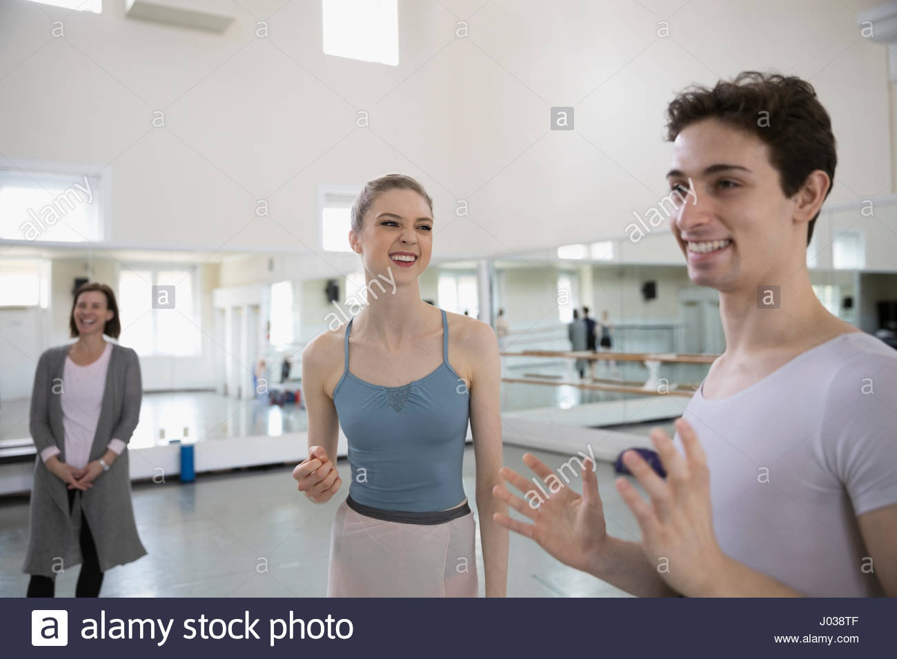 Ballet dancers talking and laughing in dance studio Stock Photo - Alamy