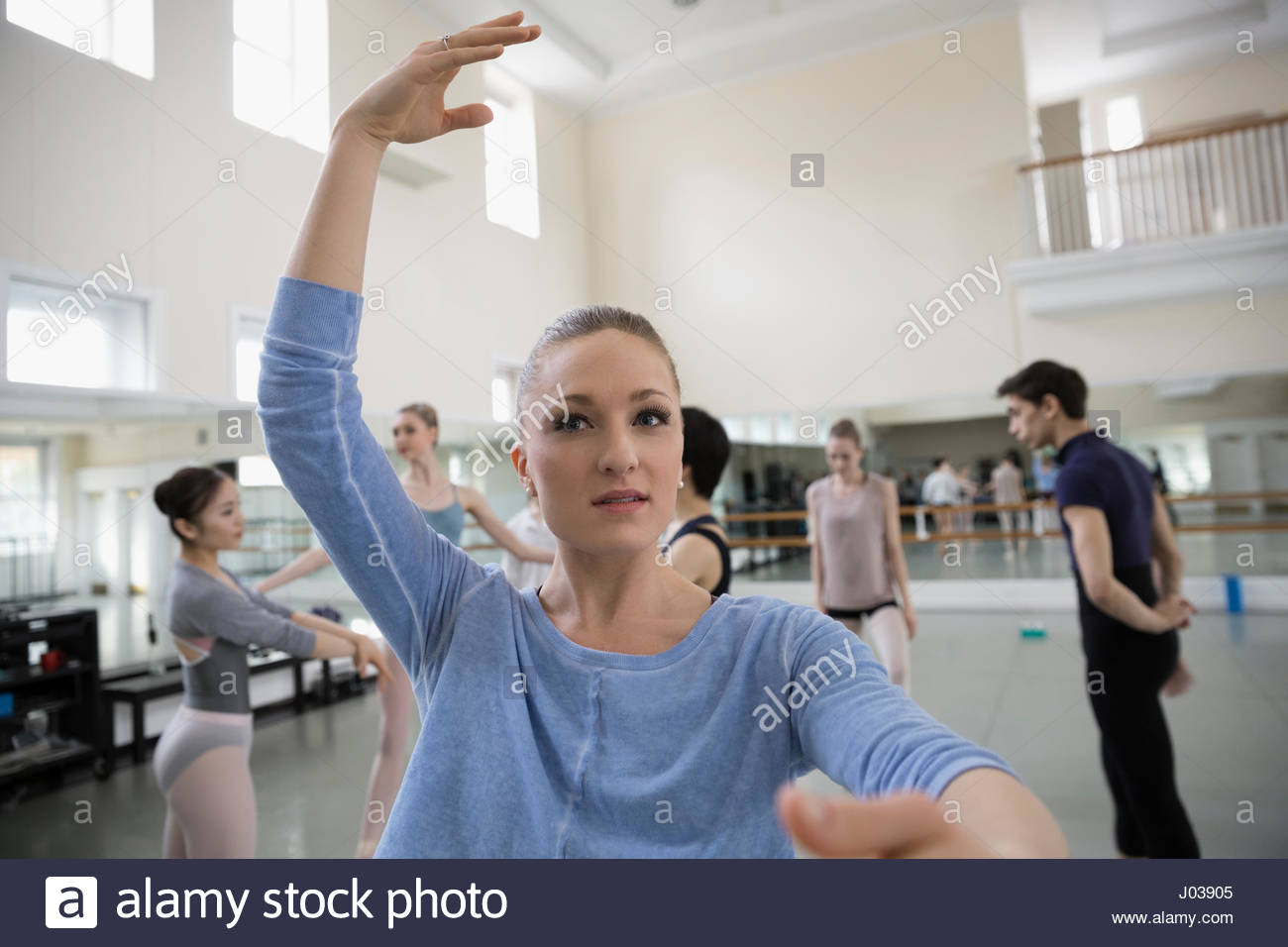 Portrait confident female ballet dancer practicing in dance studio ...