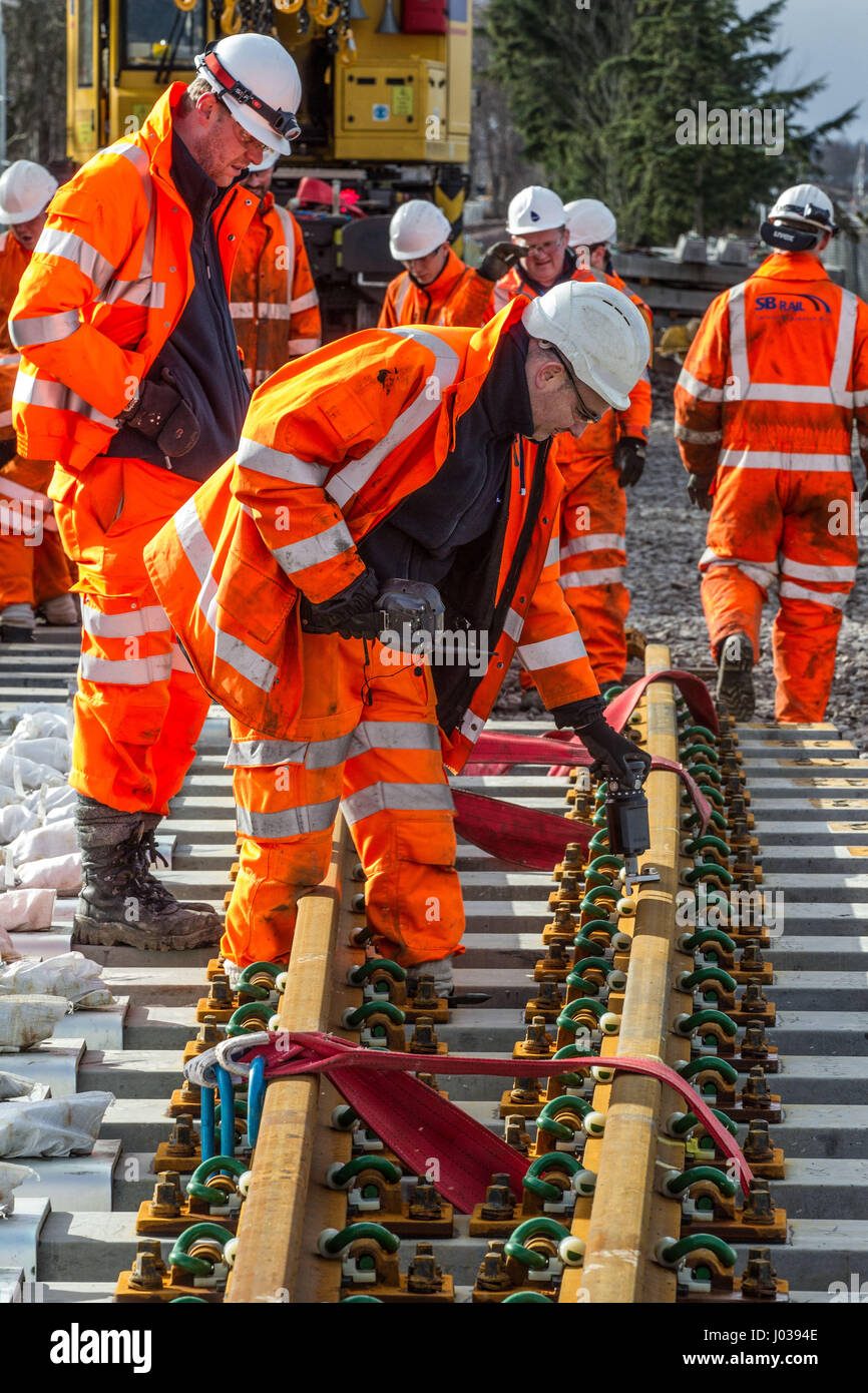 Rail construction workers installing new tracks and points Stock Photo ...