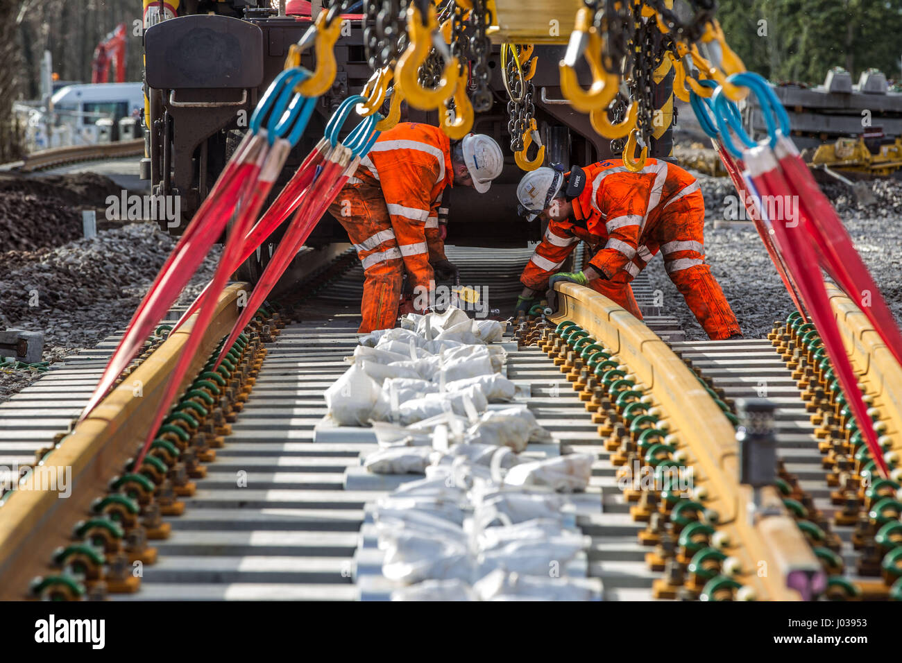 Rail construction workers installing new tracks and points Stock Photo ...