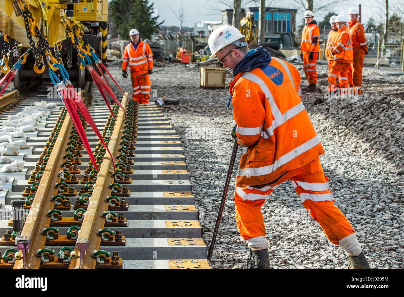 Rail construction workers installing new tracks and points Stock Photo ...