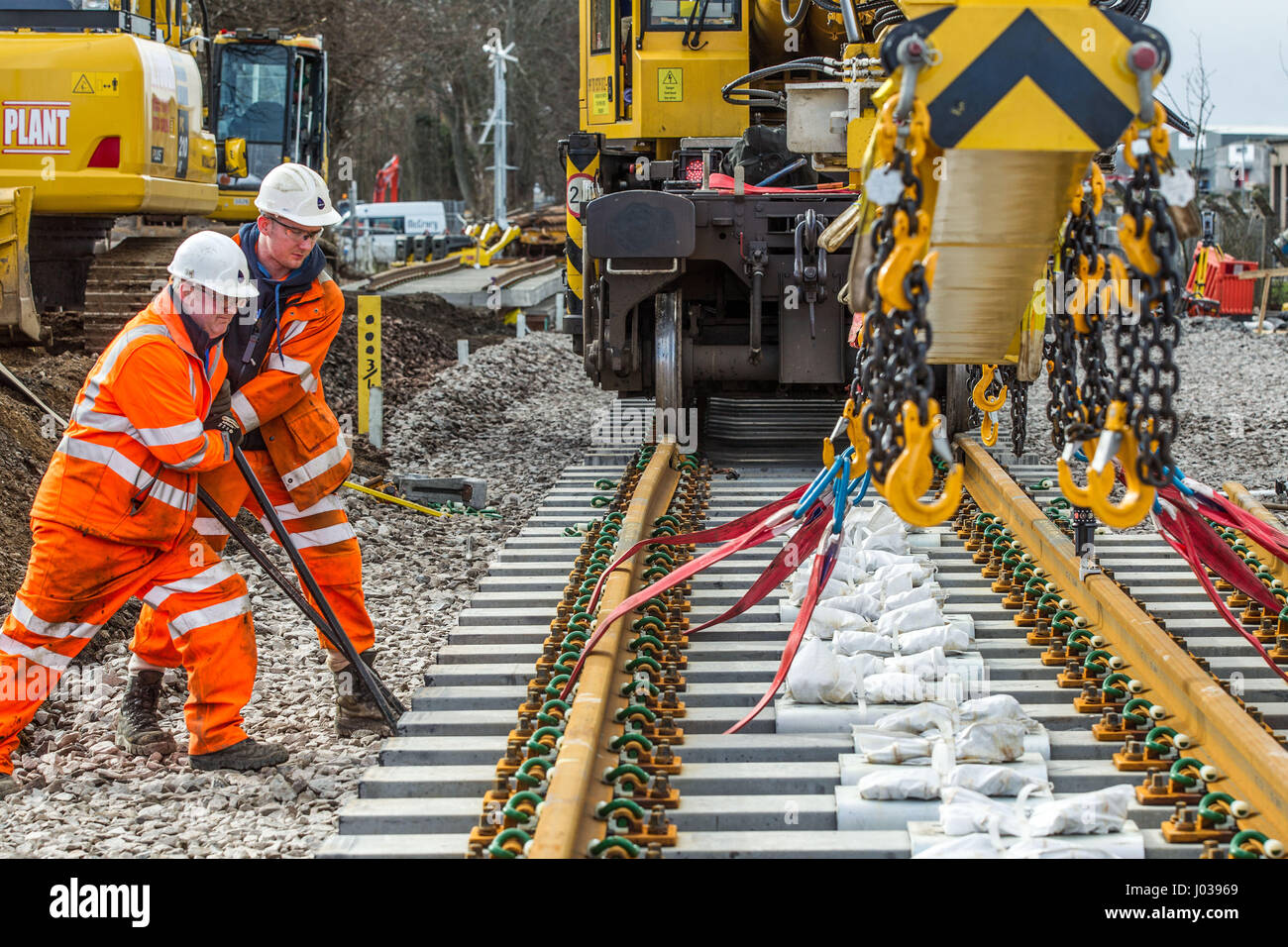 Rail construction workers installing new tracks and points Stock Photo ...