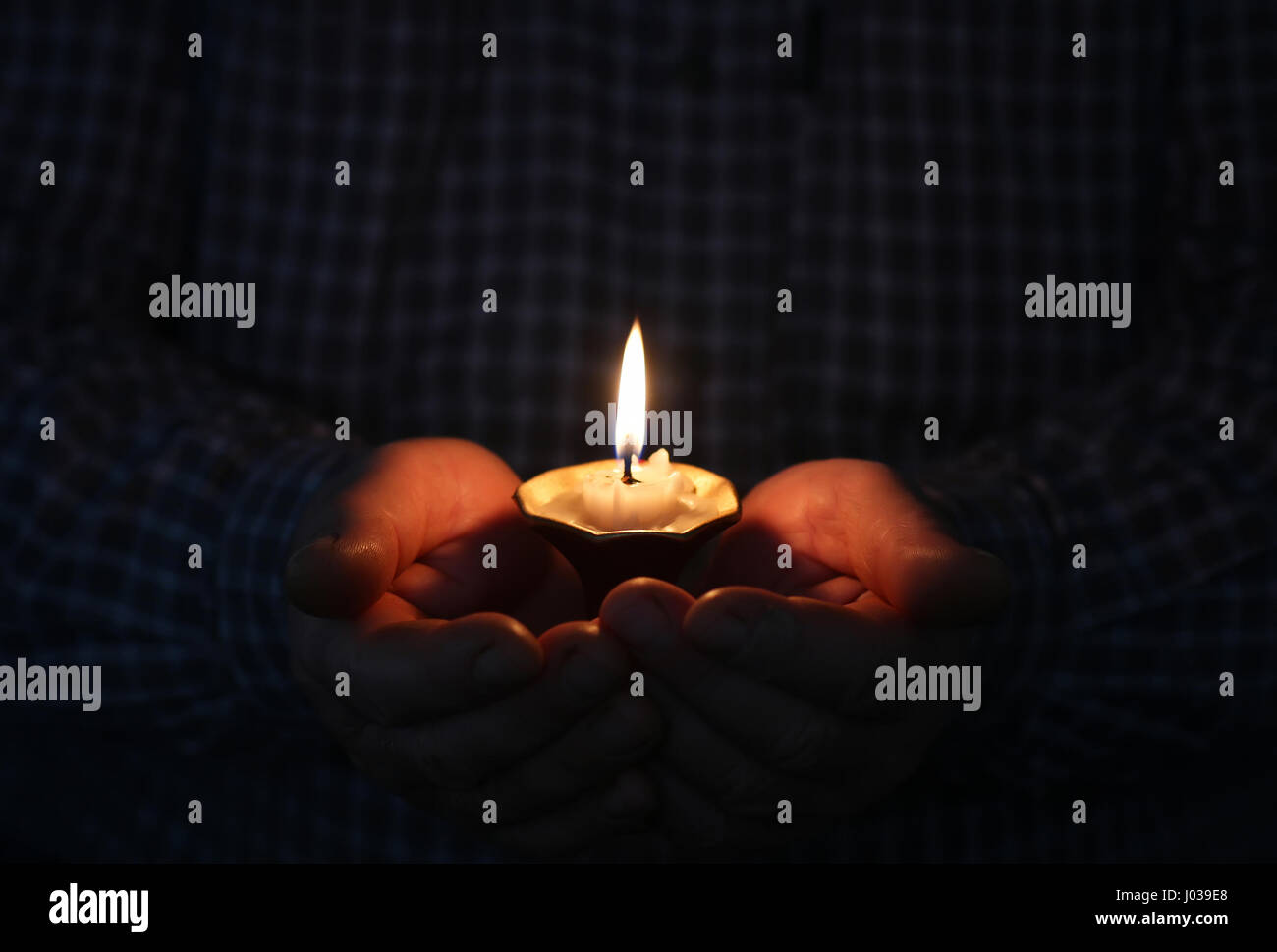 burning candle in a hand Stock Photo - Alamy