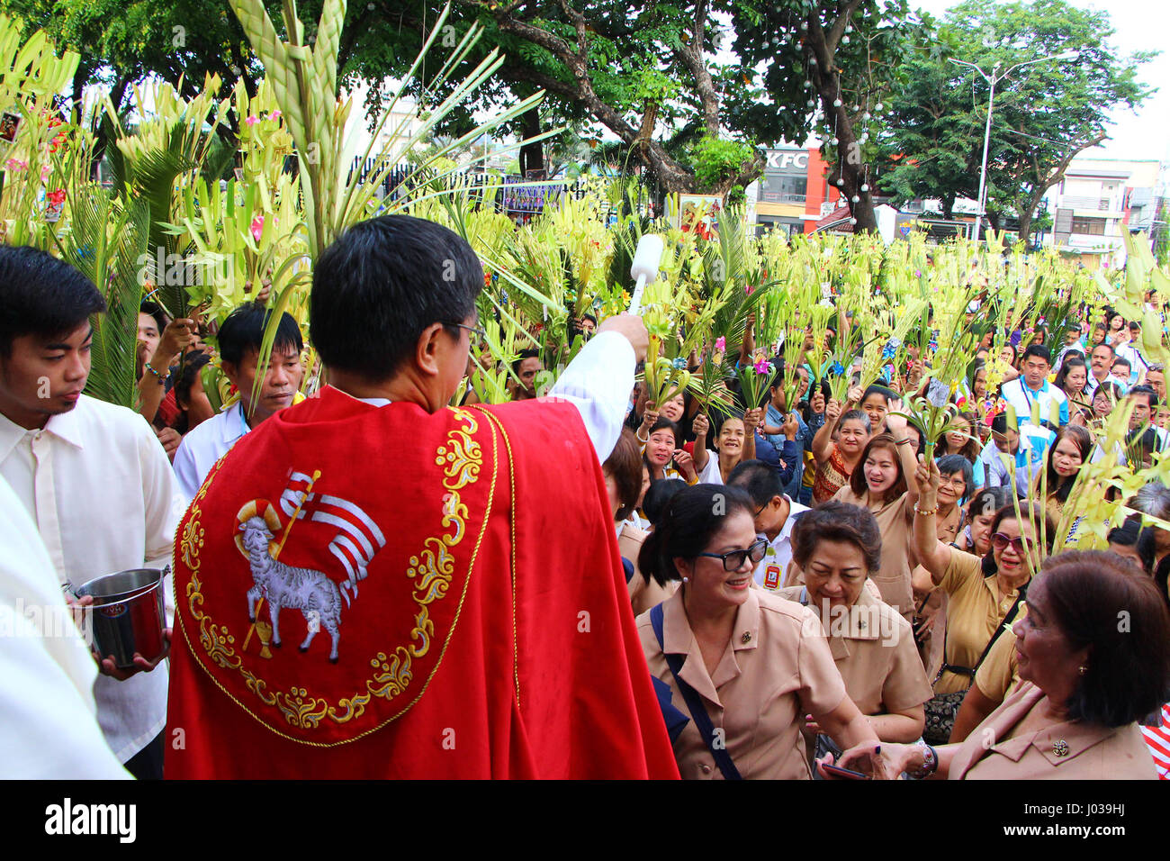A priest blessed all the palm leaves (palaspas) in celebration of Palm ...