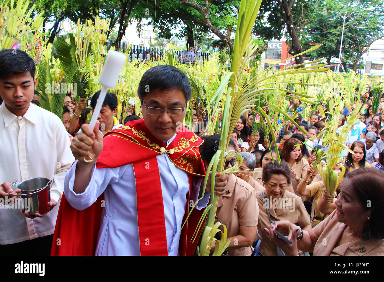 A priest blessed all the palm leaves (palaspas) in celebration of Palm ...