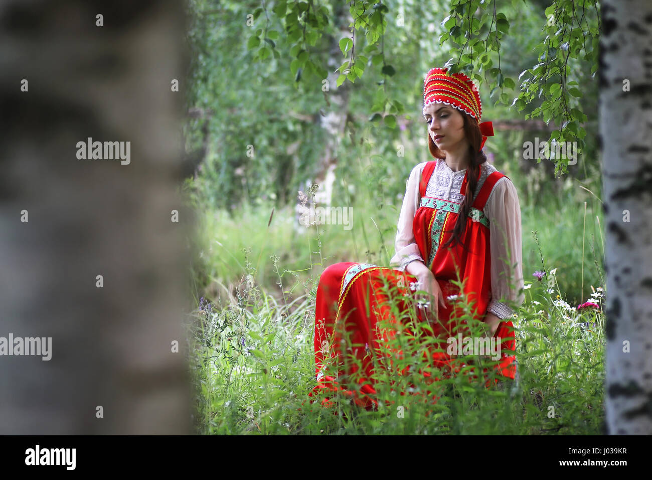 Slav in traditional dress is sitting in nature Stock Photo - Alamy
