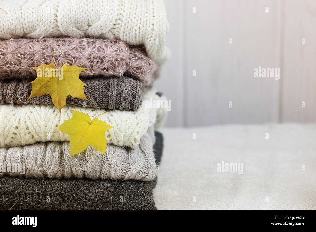 stack of sweaters knitted autumn concept Stock Photo - Alamy