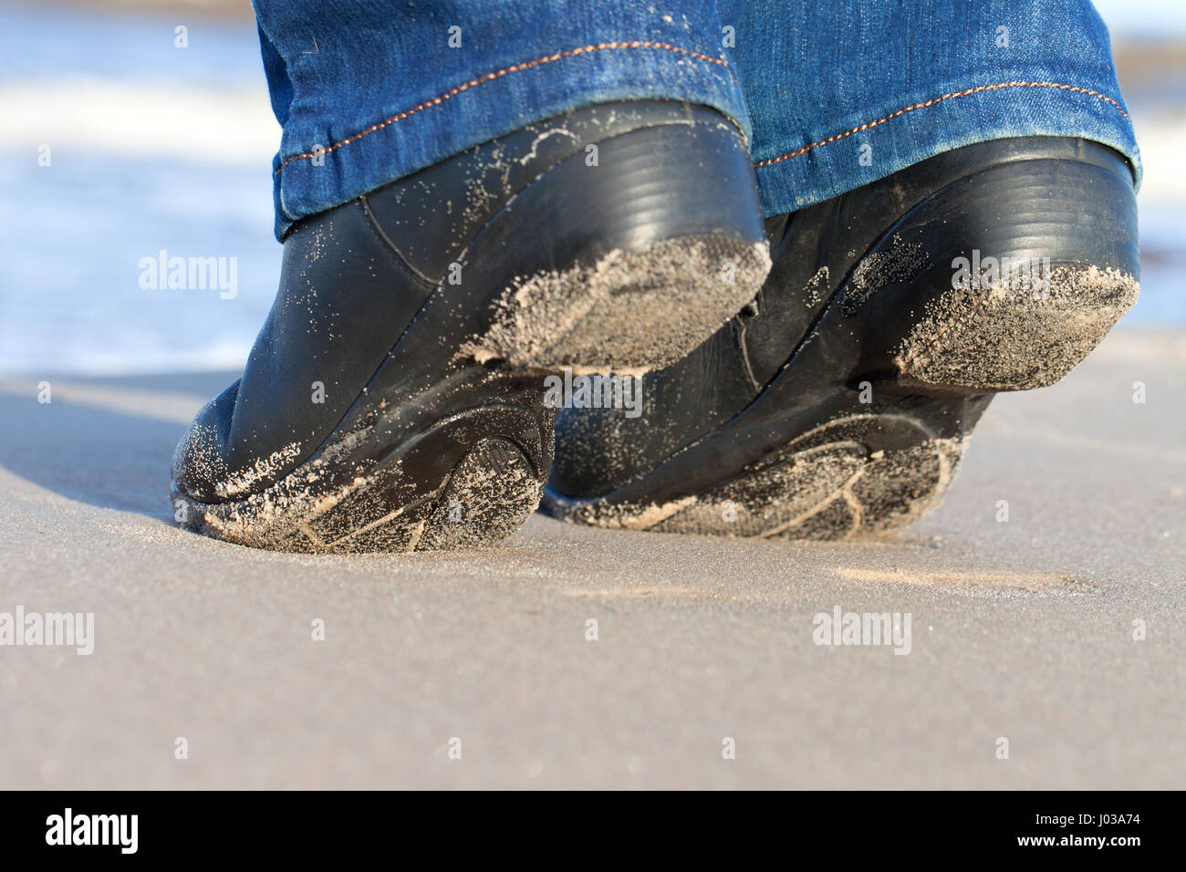 Legs on sand Stock Photo - Alamy