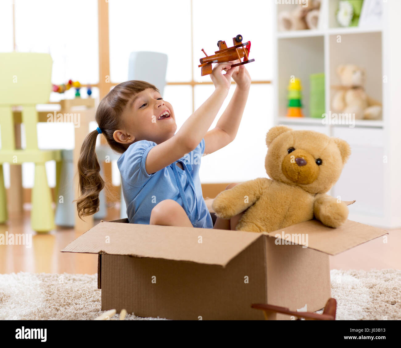 Child pilot flying a cardboard box Stock Photo - Alamy