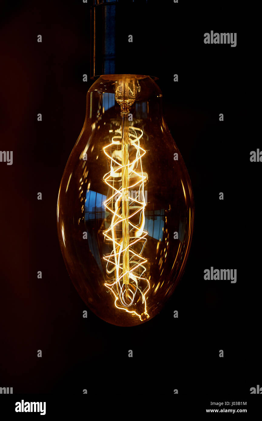 Edison light bulb hanging on a long wire. Cozy warm yellow light.Retro ...