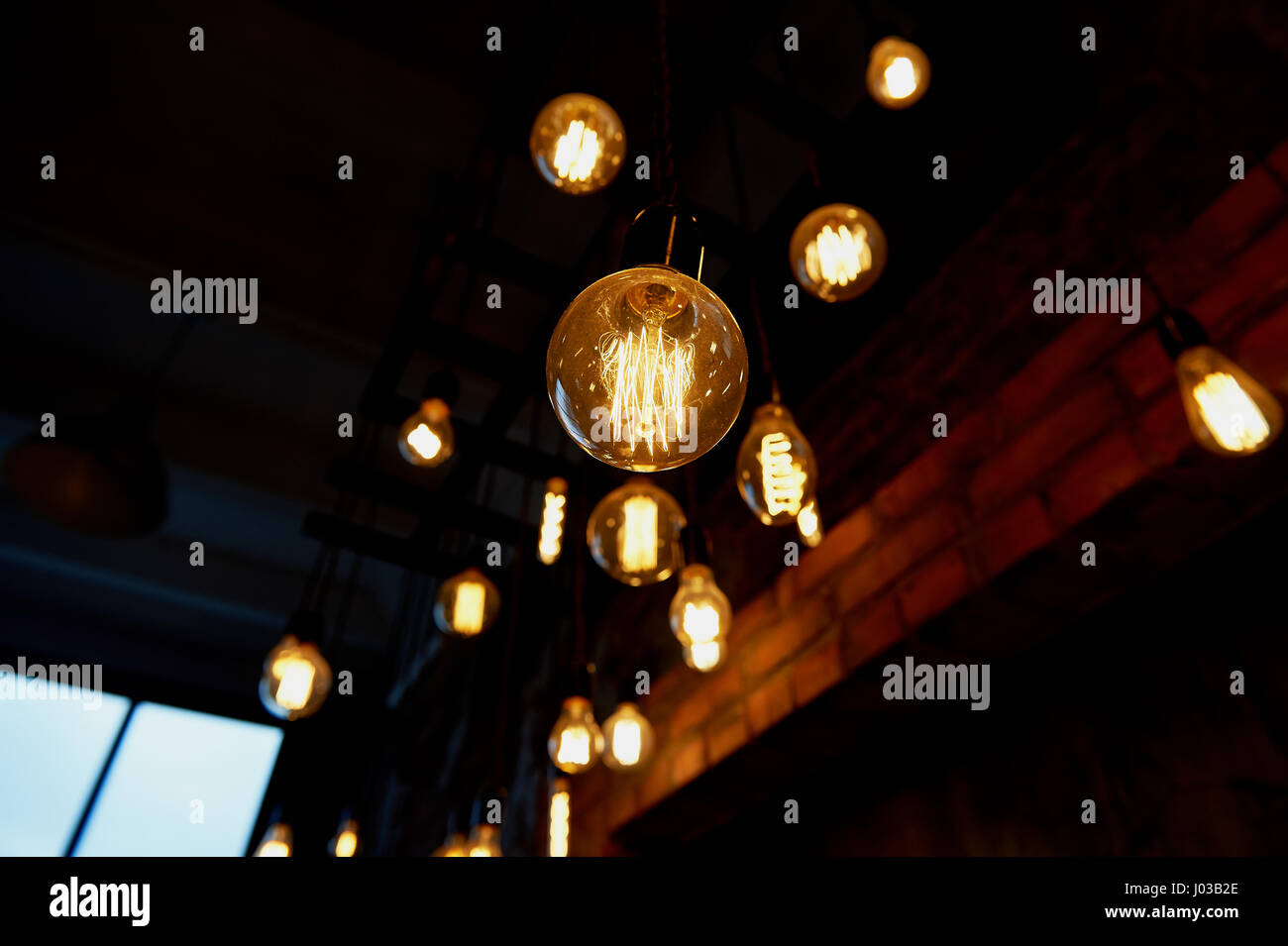 Edison light bulb hanging on a long wire. Cozy warm yellow light.Retro ...