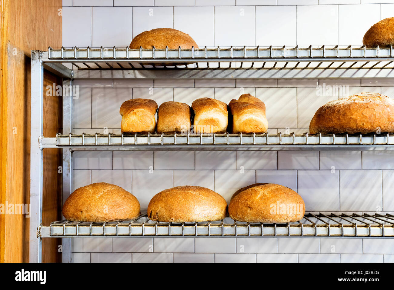 Artisan Freshly Baked Bread Displayed on a Metal Wired Shelving Unit ...