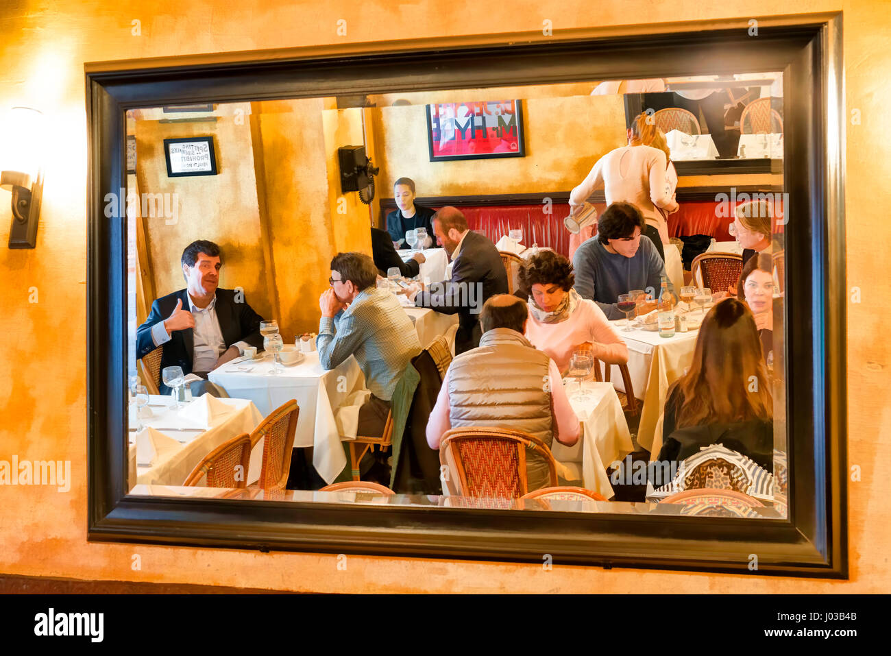 Wall Mirror Reflections in a NYC French Restaurant Stock Photo - Alamy