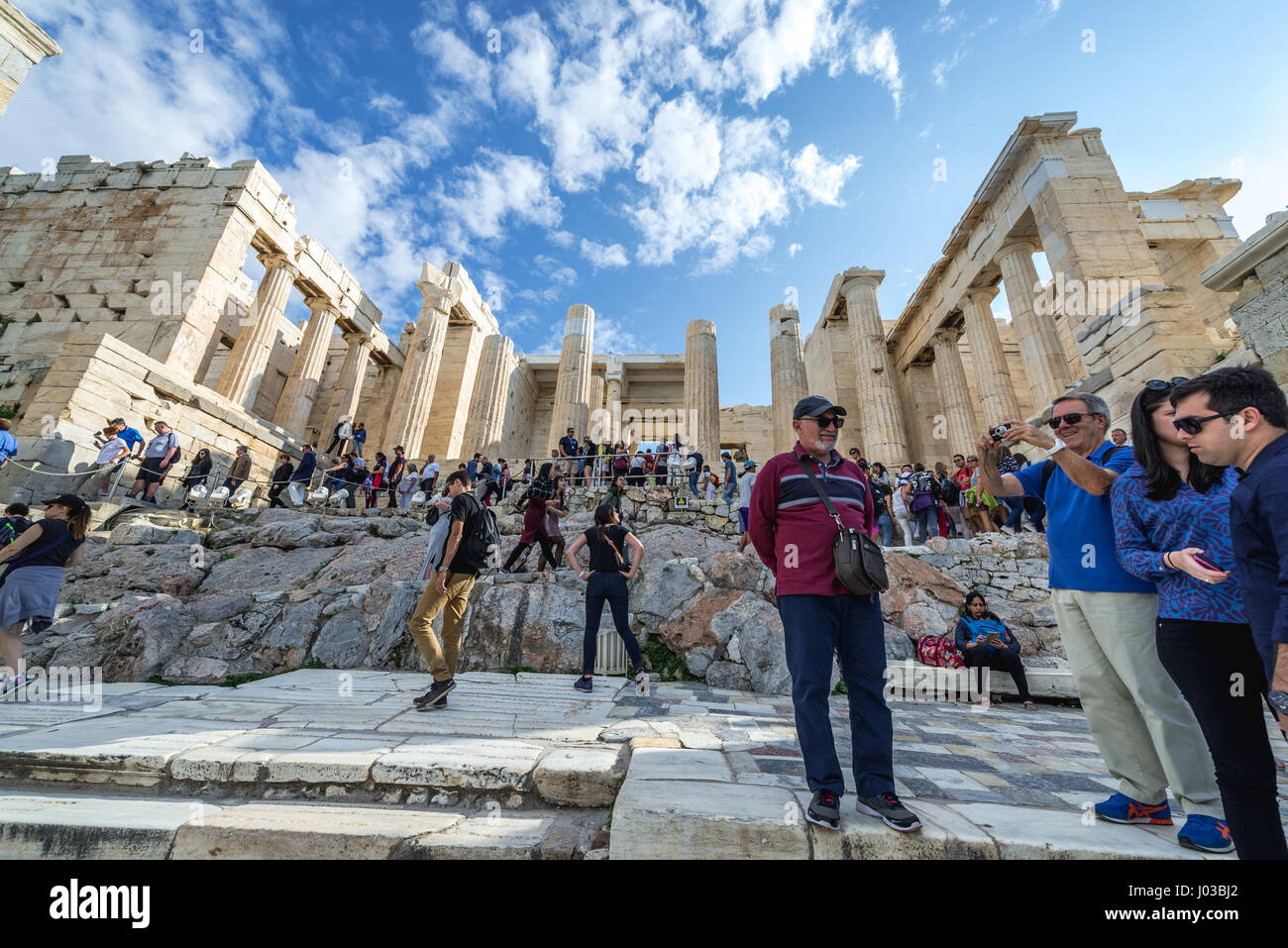 Tourists on a stairs in front of gateway called Propylaea, entrance to ...