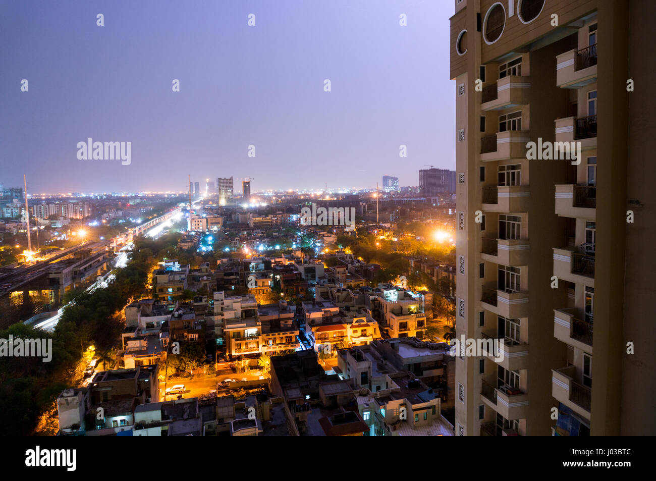 Noida cityscape at night with houses, office, skyscrapers, streets and ...